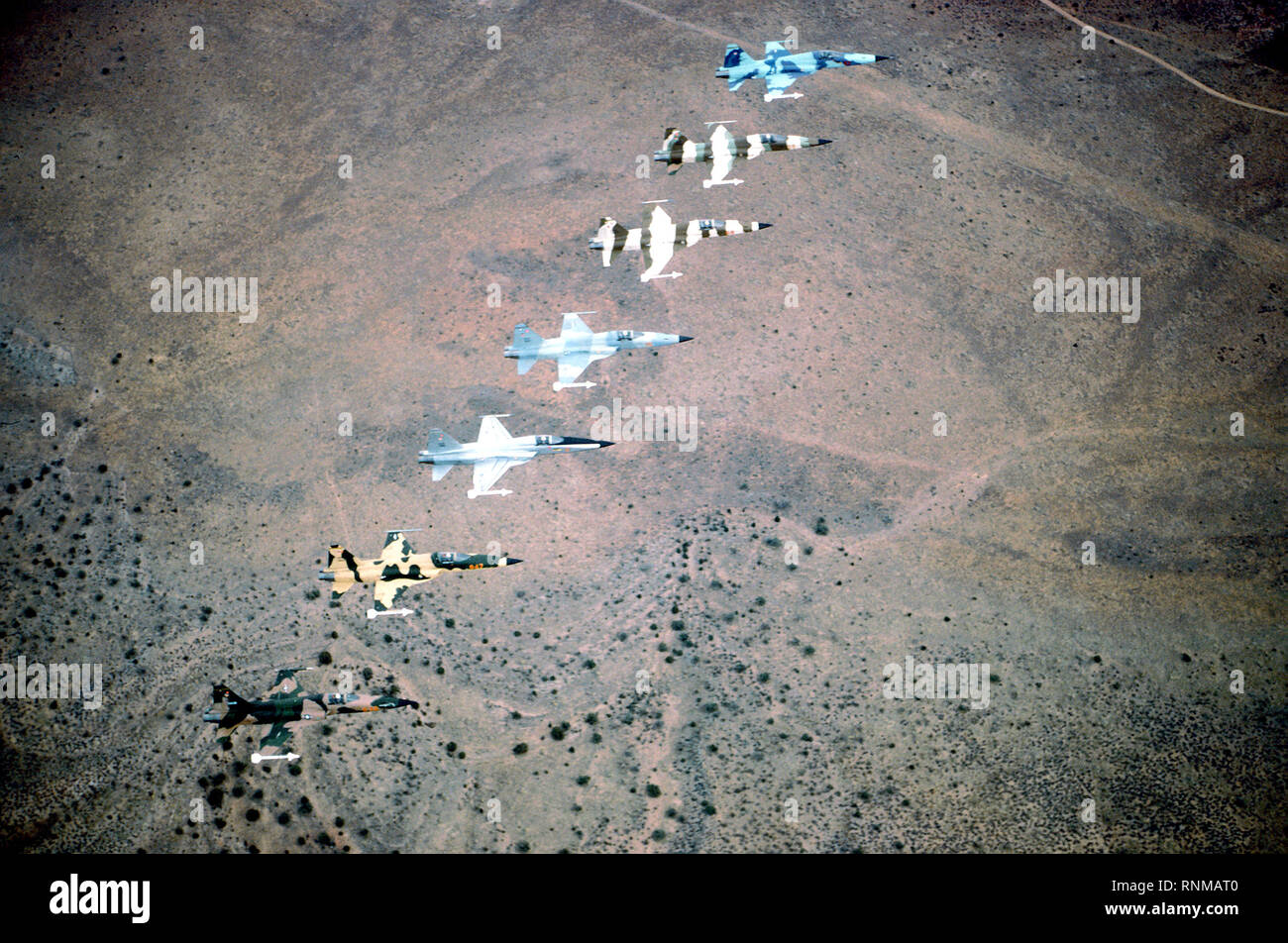 1981 - An air-to-air overhead view of a seven-ship echelon formation of ...
