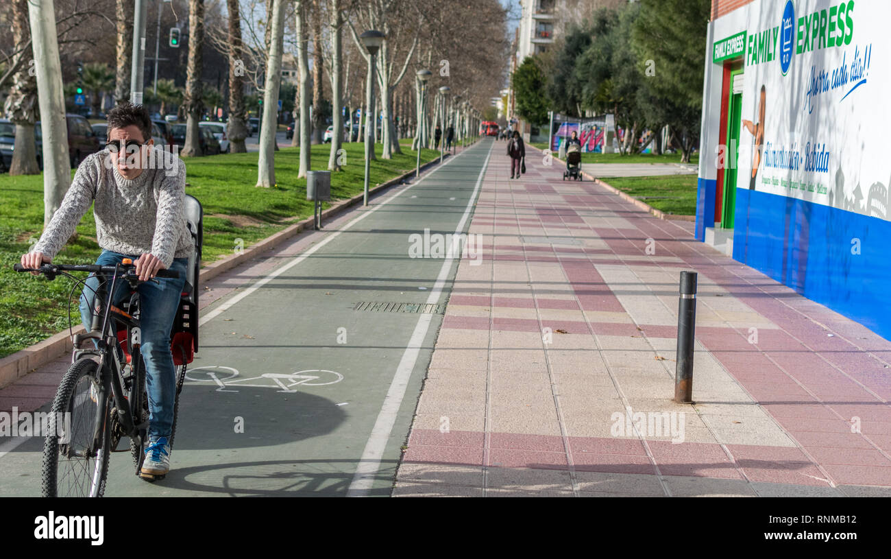 Murcia, Spain; February 18, 2019: Man driving bike over bike line along ...