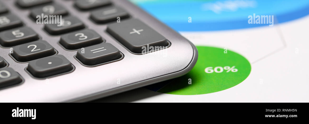 Silver calculator and financial statistics on clipboard Stock Photo - Alamy