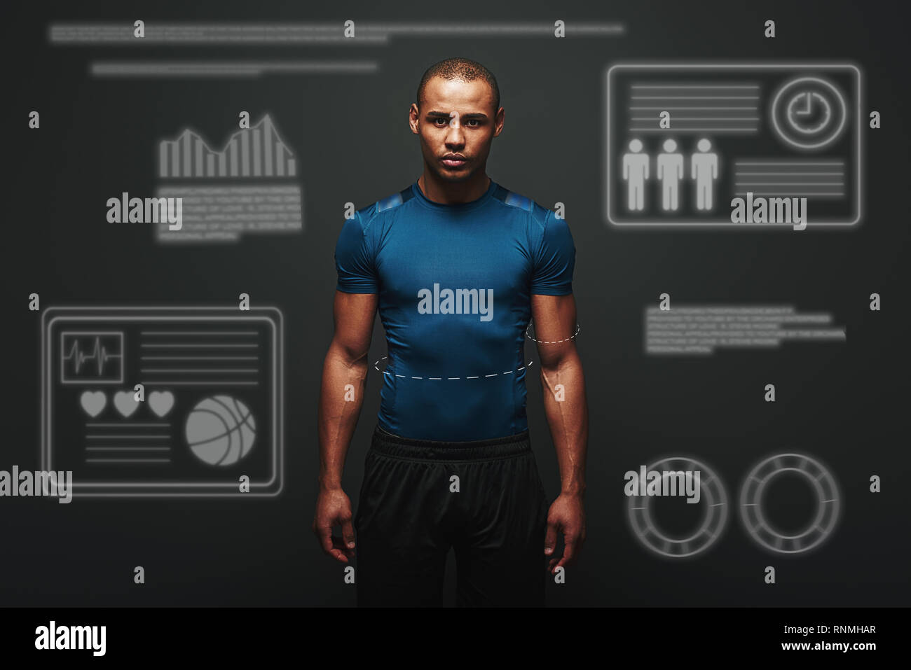 Portrait of handsome fitness man in blue T-shirt and black shorts ...