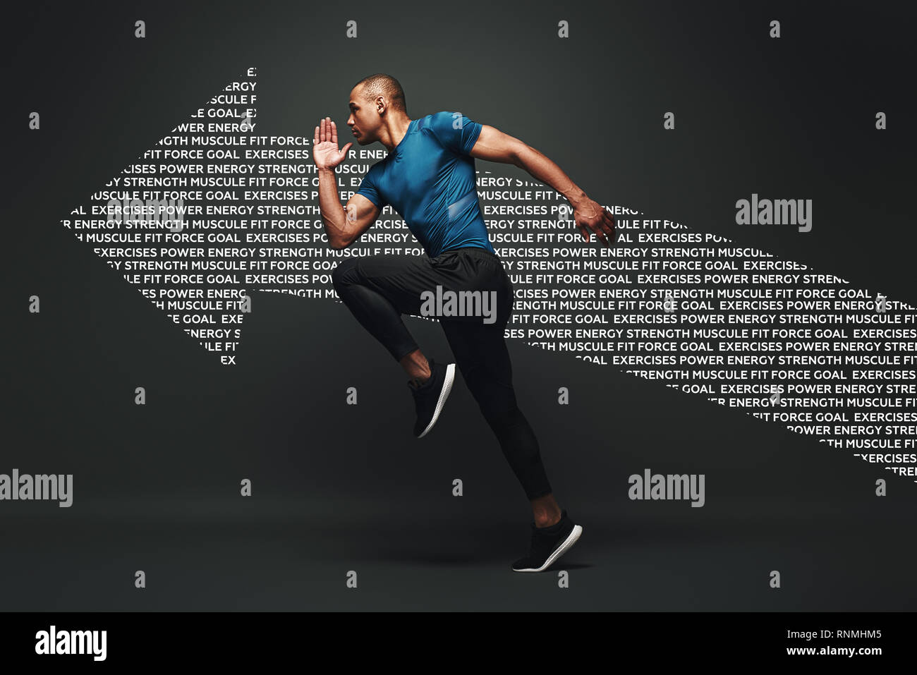 Full length portrait of a healthy muscular sportsman jumping over dark ...