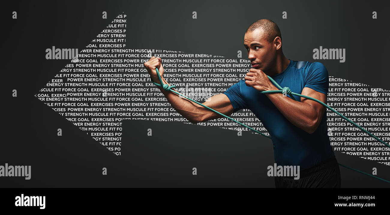 Studio portrait of clean shaven young dark skinned male athlete with ...