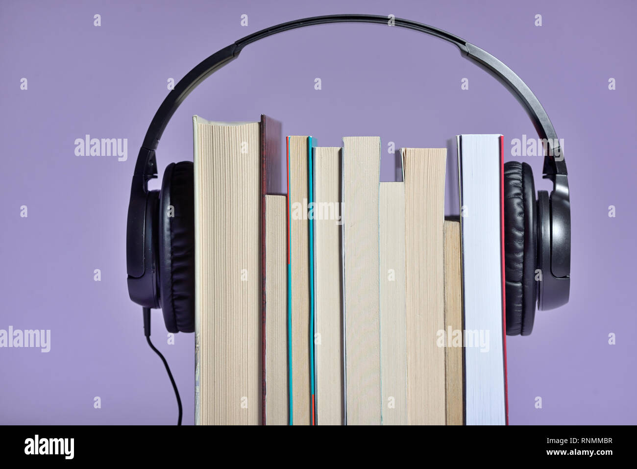 Audio books concept with books and headphones Stock Photo - Alamy