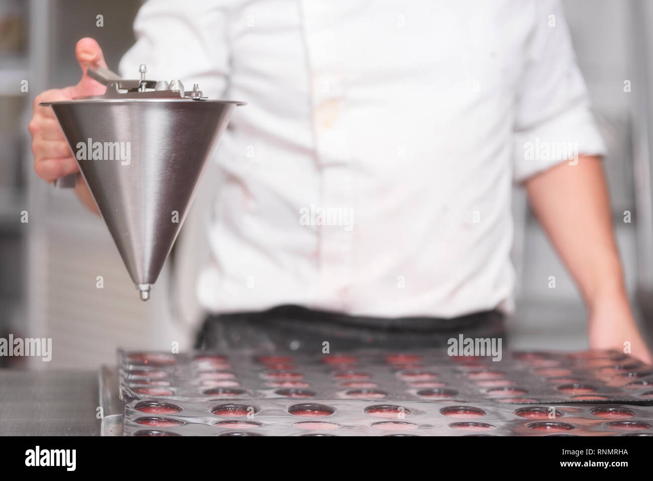Professional pastry chef pouring white hi-res stock photography and ...