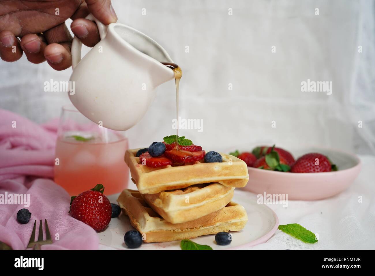 Hand pouring syrup hi-res stock photography and images - Alamy