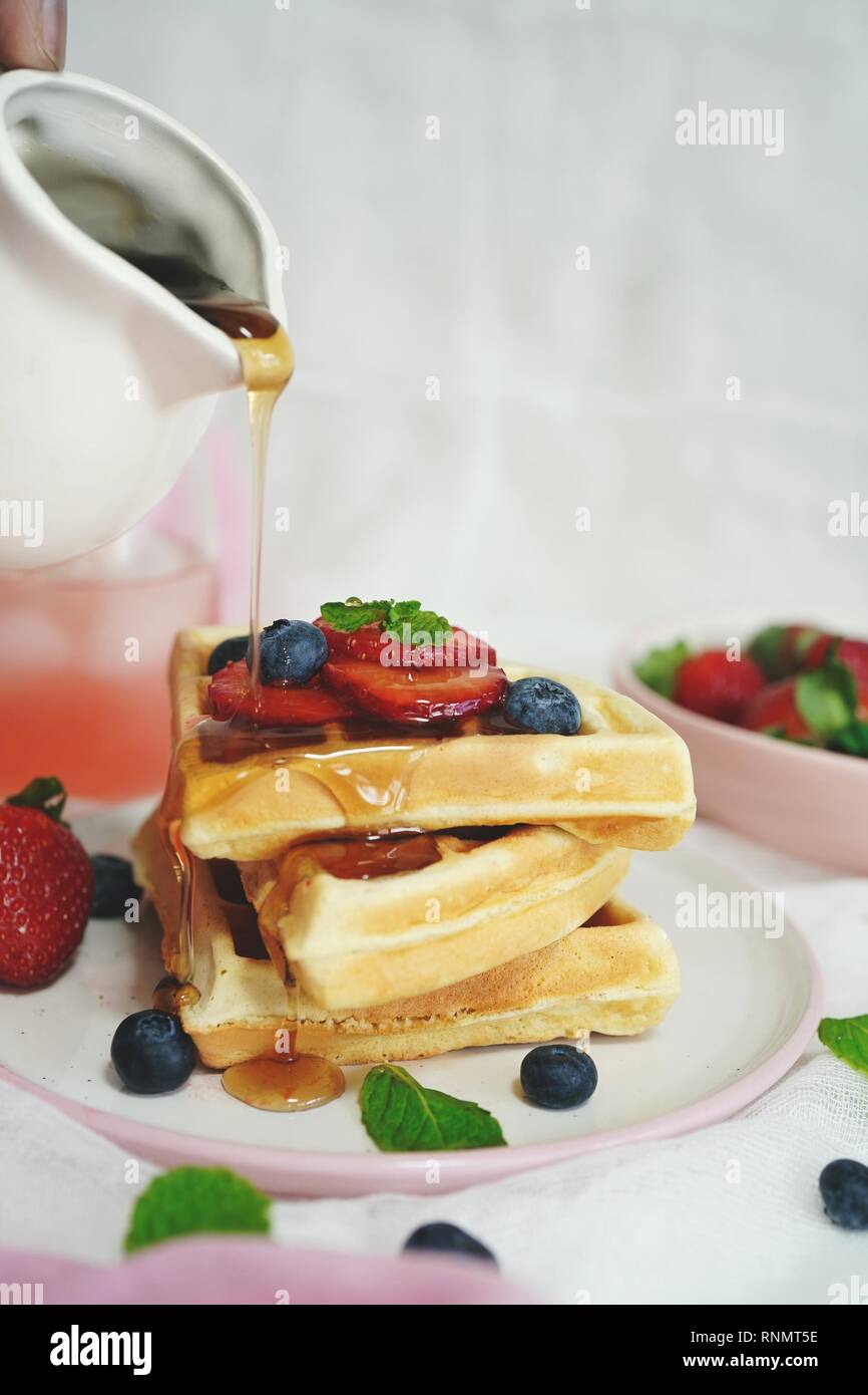 Hand pouring syrup hi-res stock photography and images - Alamy