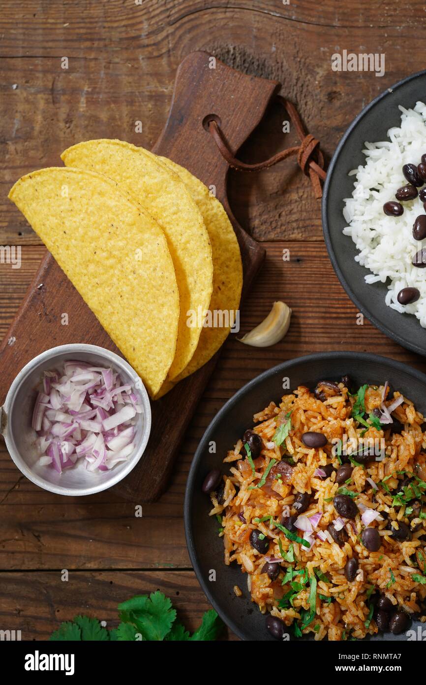 Rice and beans Taco shells on side / Mexican meal overhead view Stock ...