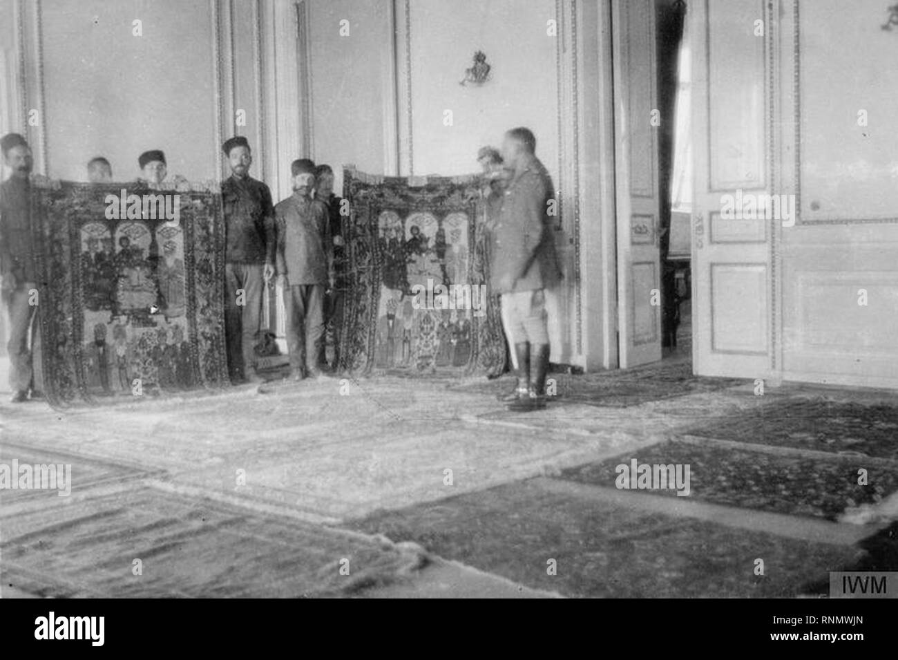Carpet sellers showing their wares to Colonel Stokes (General Staff ...