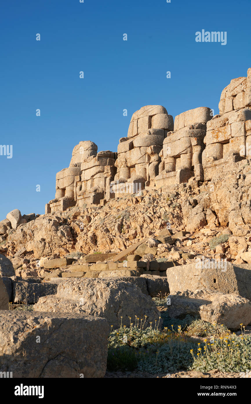Headless seated statues in front of the stone pyramid 62 BC Royal Tomb ...