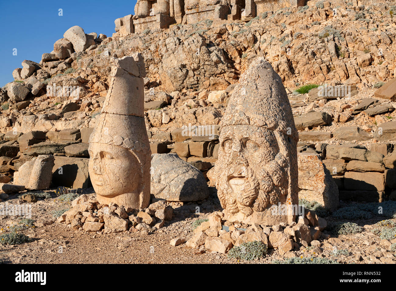 Statue heads, from right, Herekles & Apollo in front of the stone ...