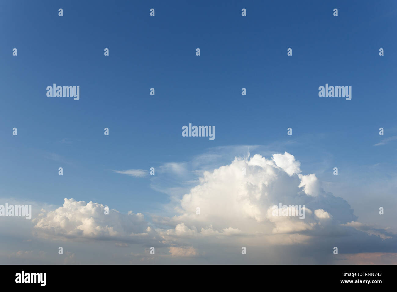 Fluffy white clouds in the blue sky Stock Photo - Alamy