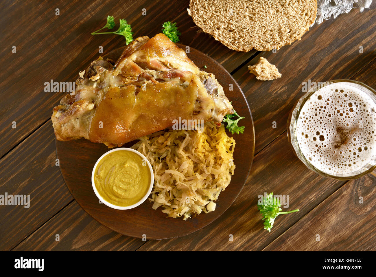 Oven baked pork knuckle (eisbein) with braised cabbage (sauerkraut) and ...