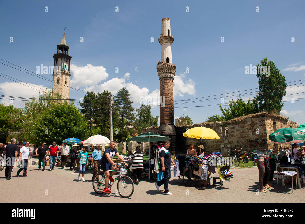 Market stalls in front of the Clock Tower and ruined mosque, Prilep ...