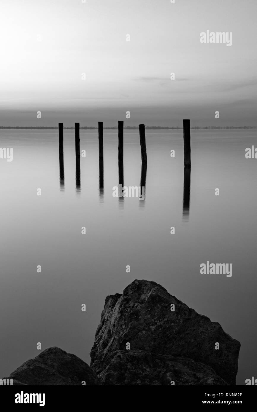 Pillars in lake Stock Photo - Alamy