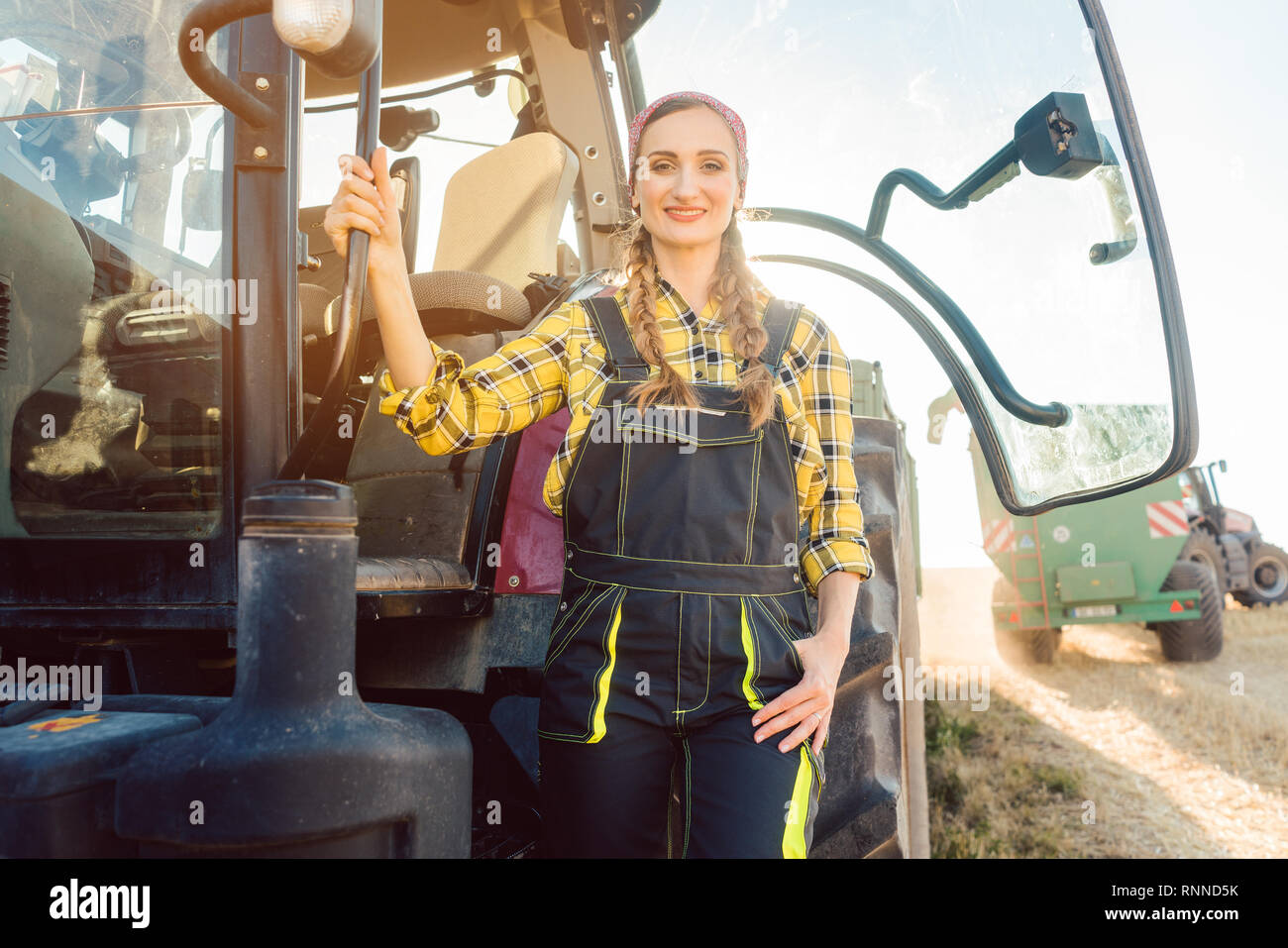 Woman driving tractor hi-res stock photography and images - Alamy