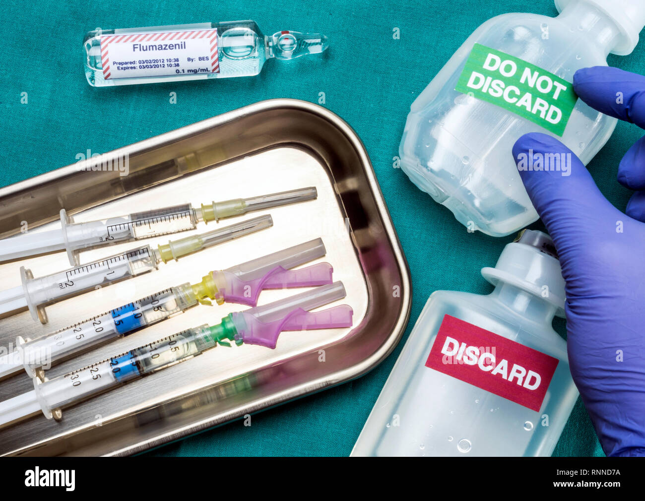 Nurse preparing parenteral medication discard and not discard, syringes ...