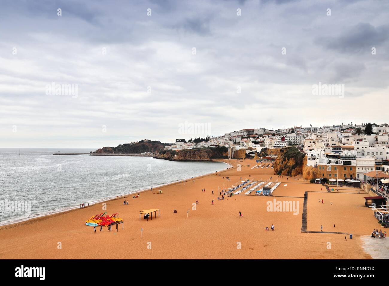 Albufeira, Portugal - overlooking beach and the city in rainy weather ...