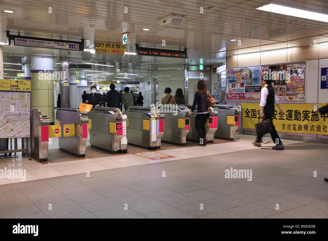 TOKYO - APRIL 13: People enter Toei Metro on April 13, 2012 in Tokyo ...