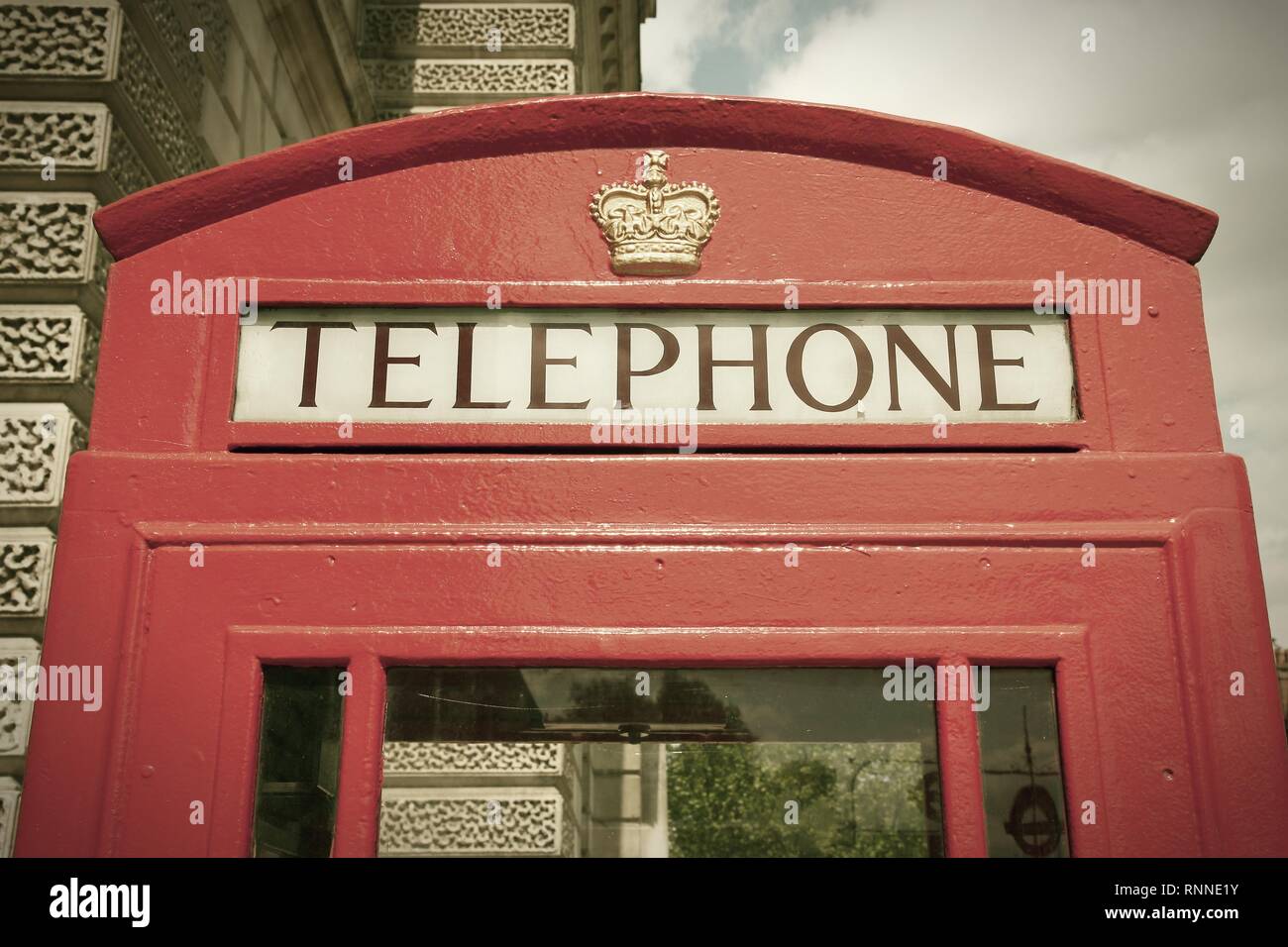 London, United Kingdom - red telephone box close-up. Cross processing ...