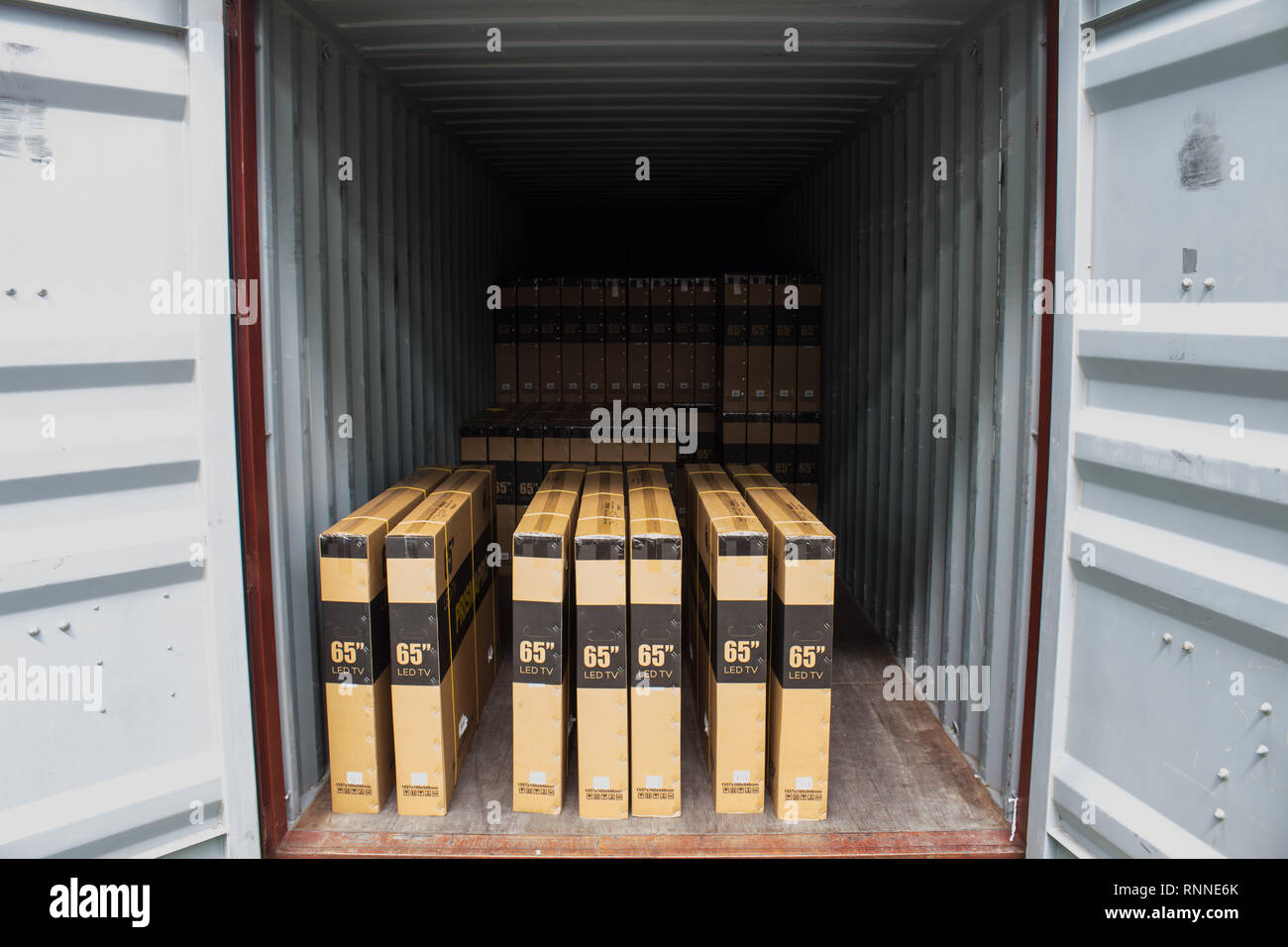 The cartons with loading into of container Stock Photo - Alamy
