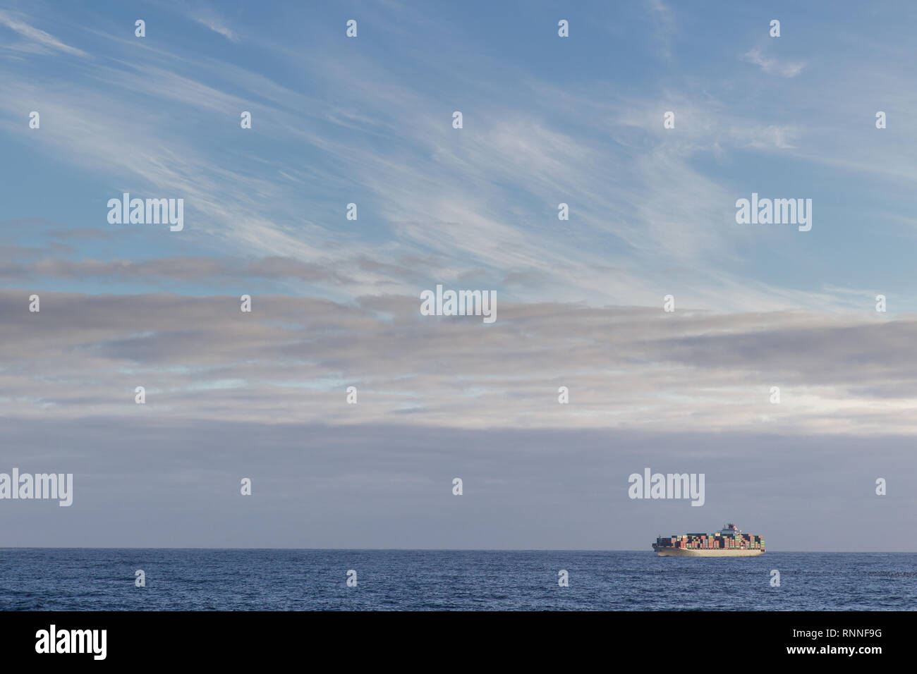 Container ship carrying a load of cargo into Table Bay Harbor, Cape ...