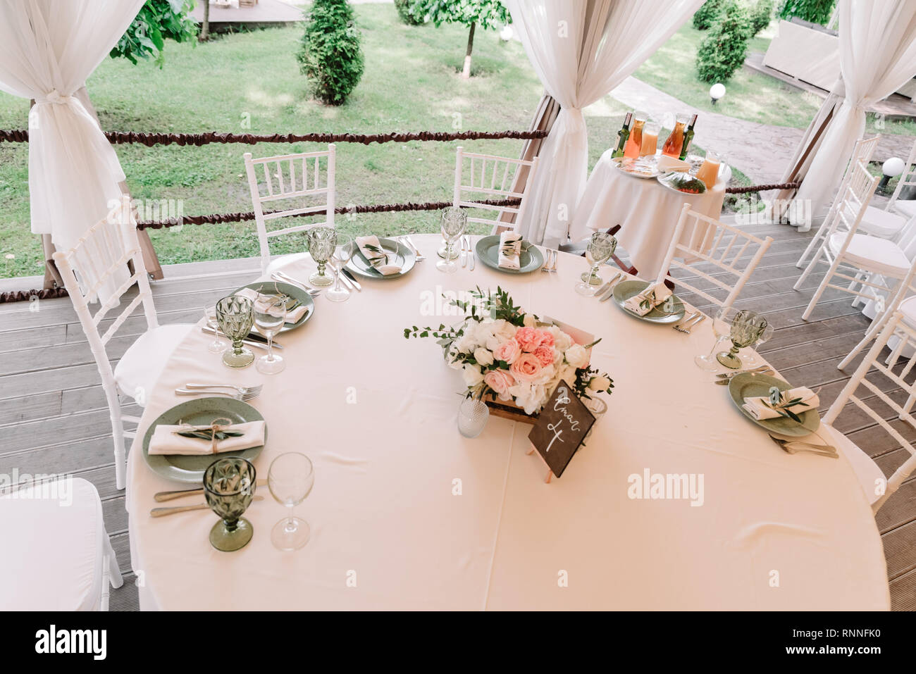 Festive lunch at restaurant. A wedding table for guests. Round banquet ...