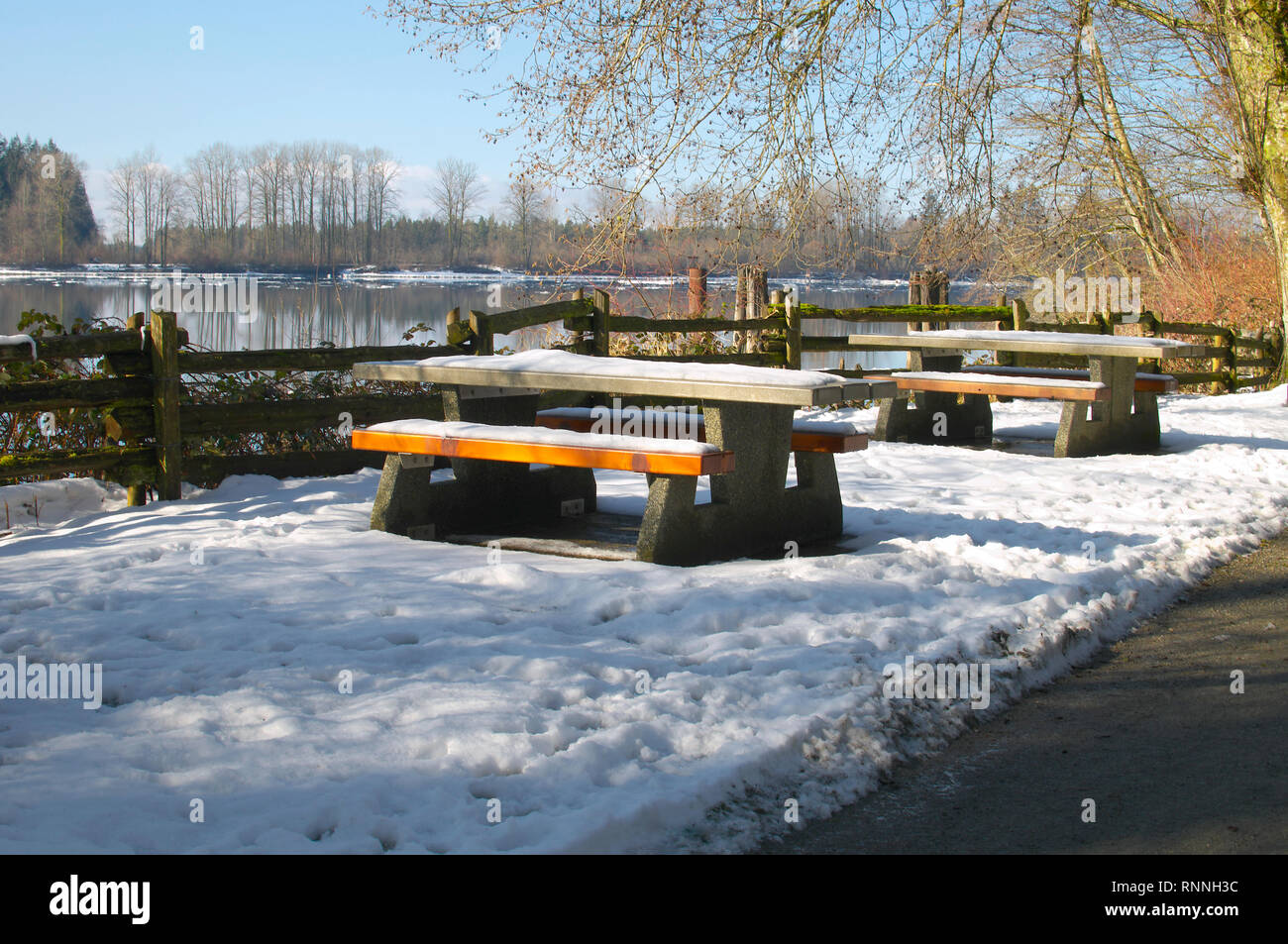 Picnic tables covered in snow. Kanaka Creek Riverfront Regional Park ...