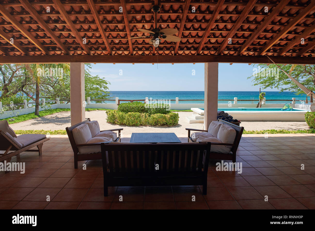 House patio on beach side with swimmong pool Stock Photo - Alamy