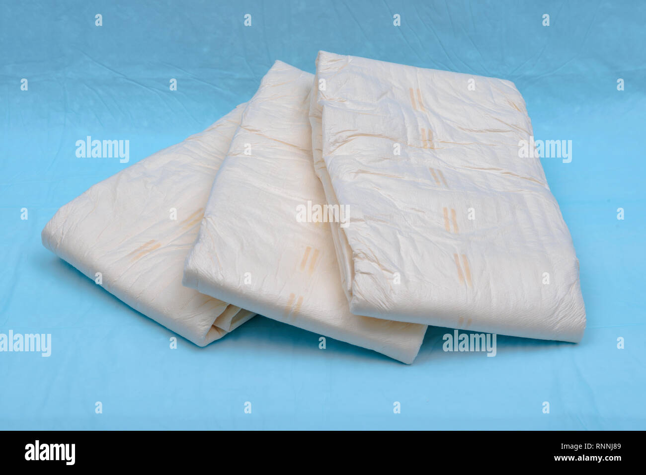 Extra Large Size Briefs For Adults Isolated On Blue Under Pad Diapers