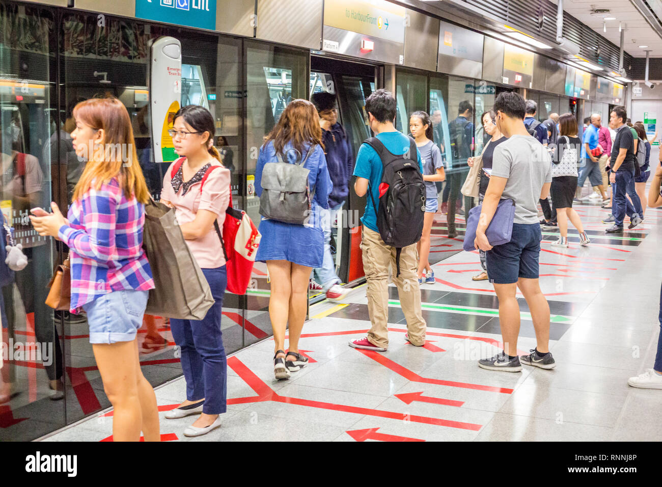 Singapore MRT Mass Rapid Transit Passengers Waiting to Board Train ...