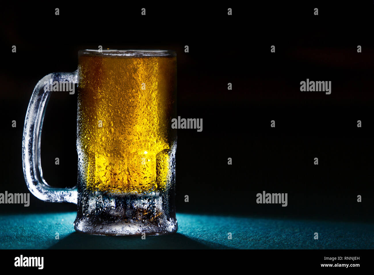 isolated cold frozen beer mug on black background Stock Photo - Alamy