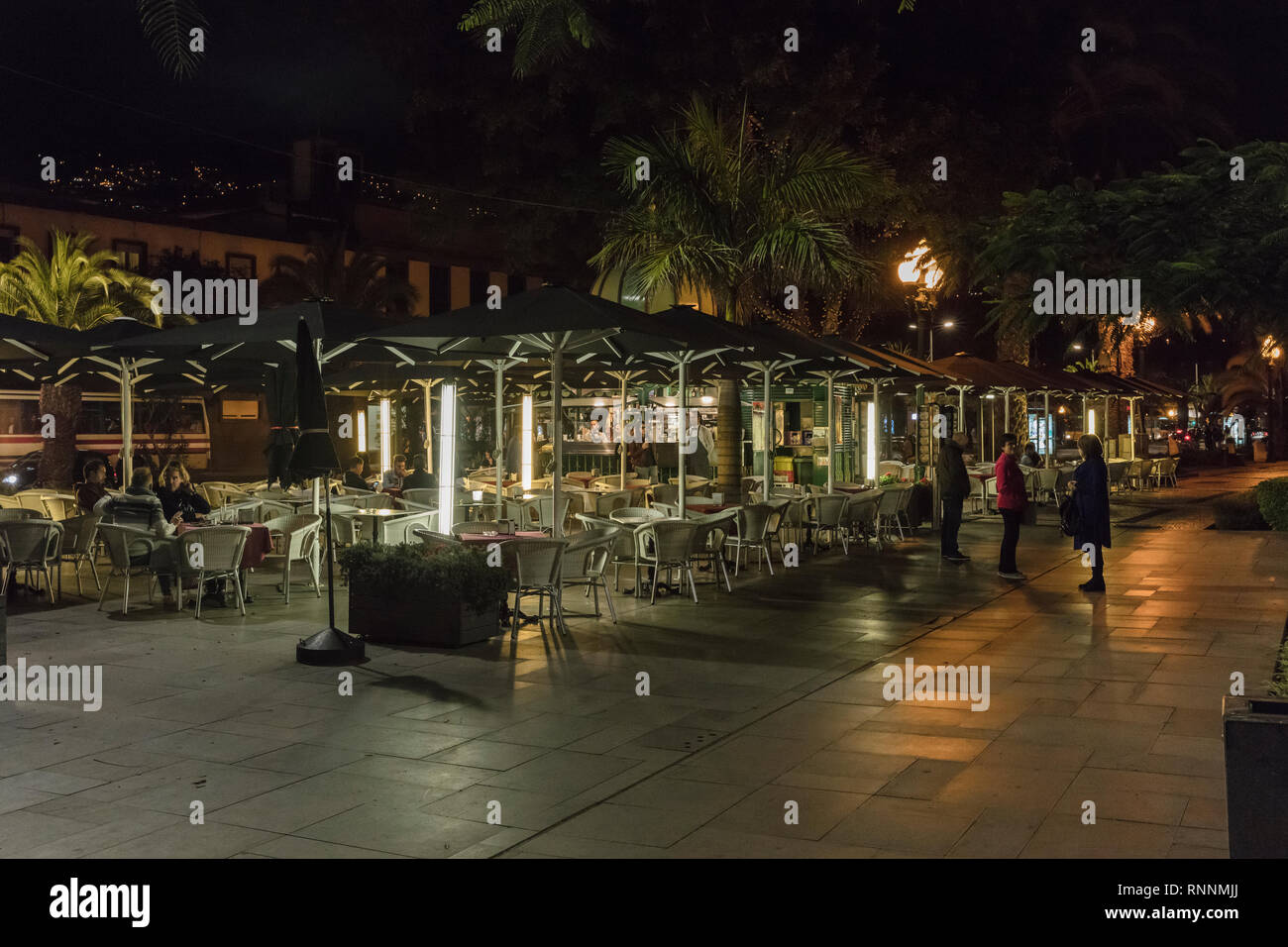 Open air restaurants at night in the Old Town of Funchal, Madeira Stock ...