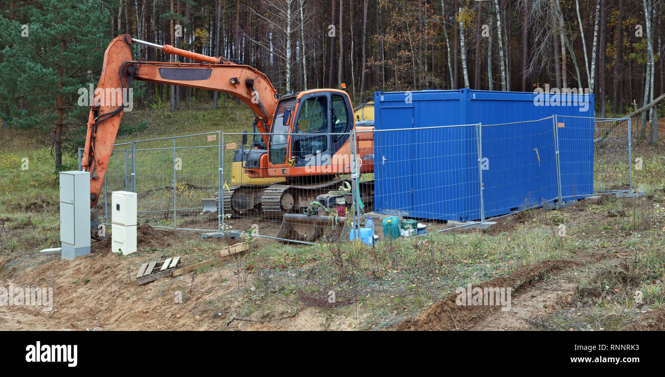 A new construction site in the autumn forest. Panoramic collage from ...