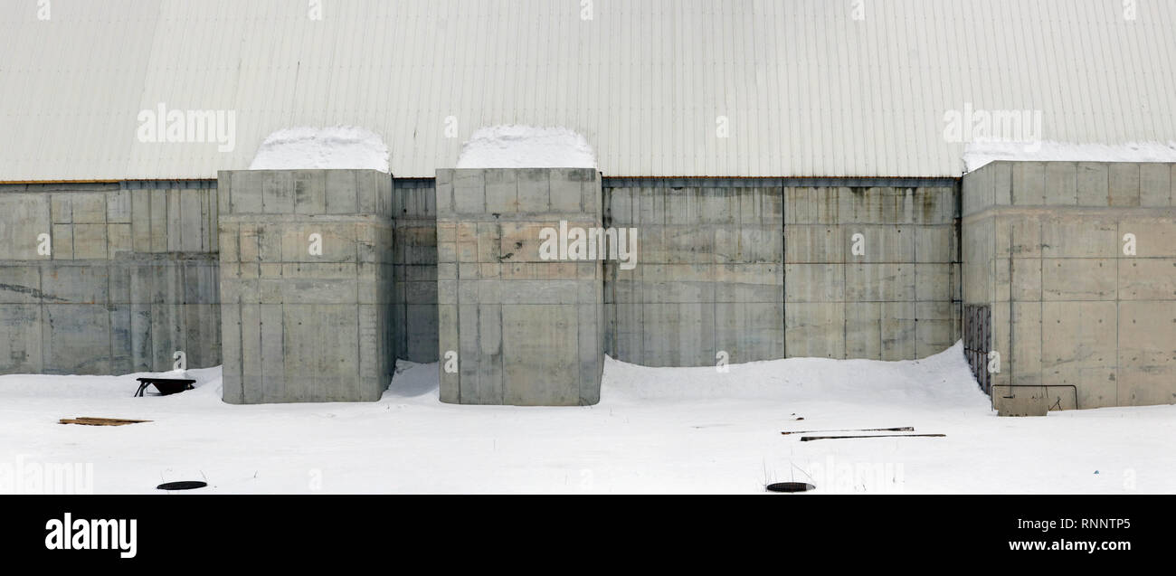 Concrete Block Wall With Snow Fluid Concrete Shell Wraps Timber