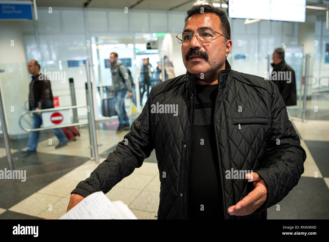 Munich, Germany. 19th Feb, 2019. Adnan S. is standing in the arrivals ...