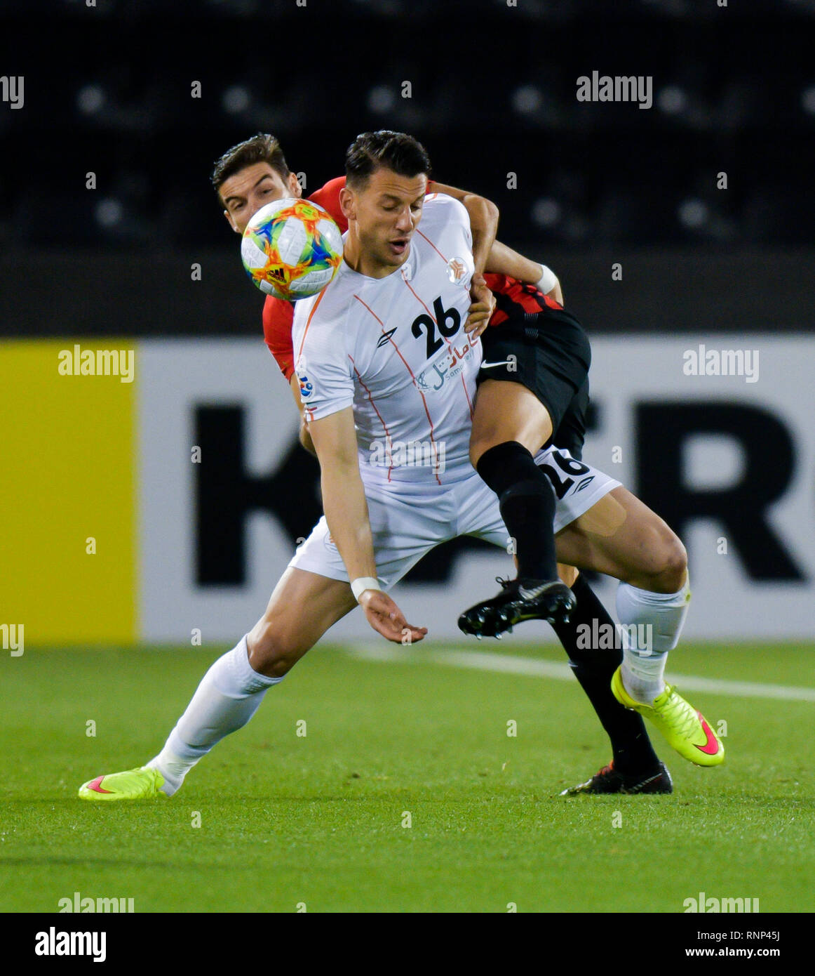 Doha, Qatar. 19th Feb, 2019. Gonzalo Viera (back) of Al Rayyan SC vies with Arman Ramezani of ...