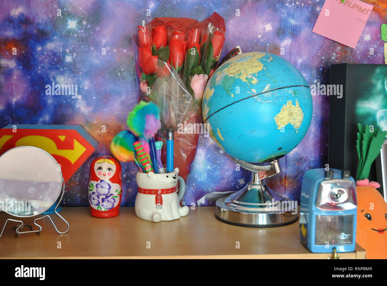 A collection of objects displayed on a shelf in a girls bedroom Stock ...