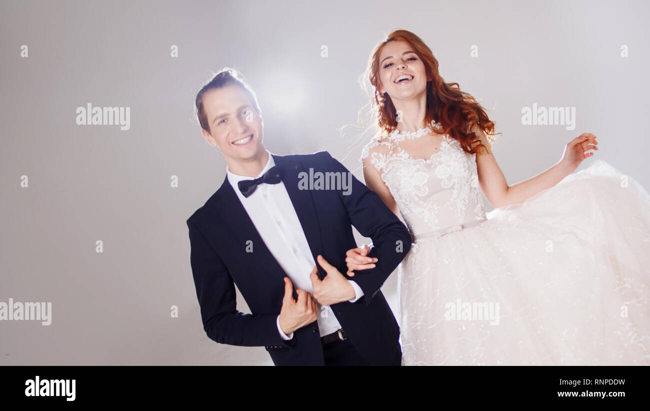 Happy young couple laughing and dancing together. The couple in the ...