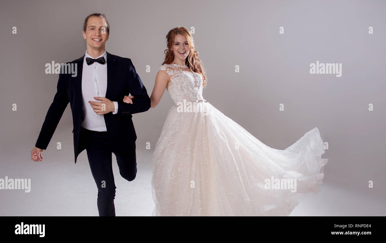 Happy young couple laughing and dancing together. The couple in the ...