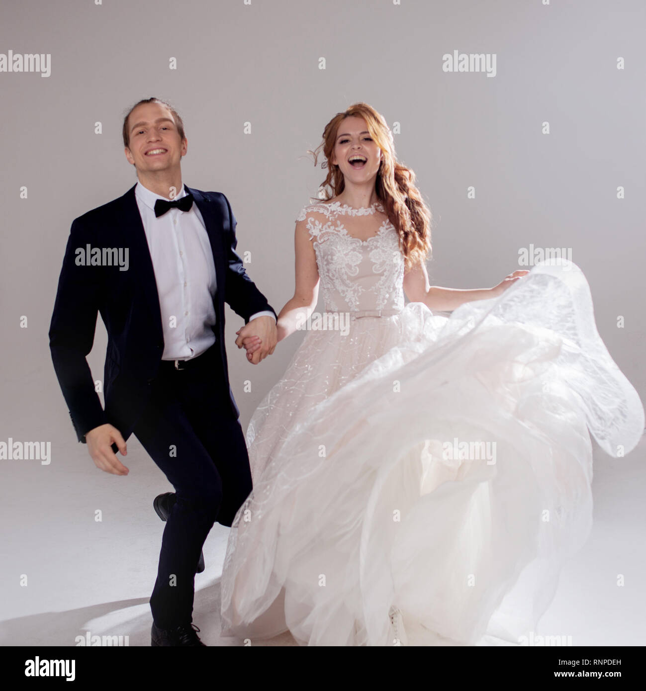 Happy young couple laughing and dancing together. The couple in the ...