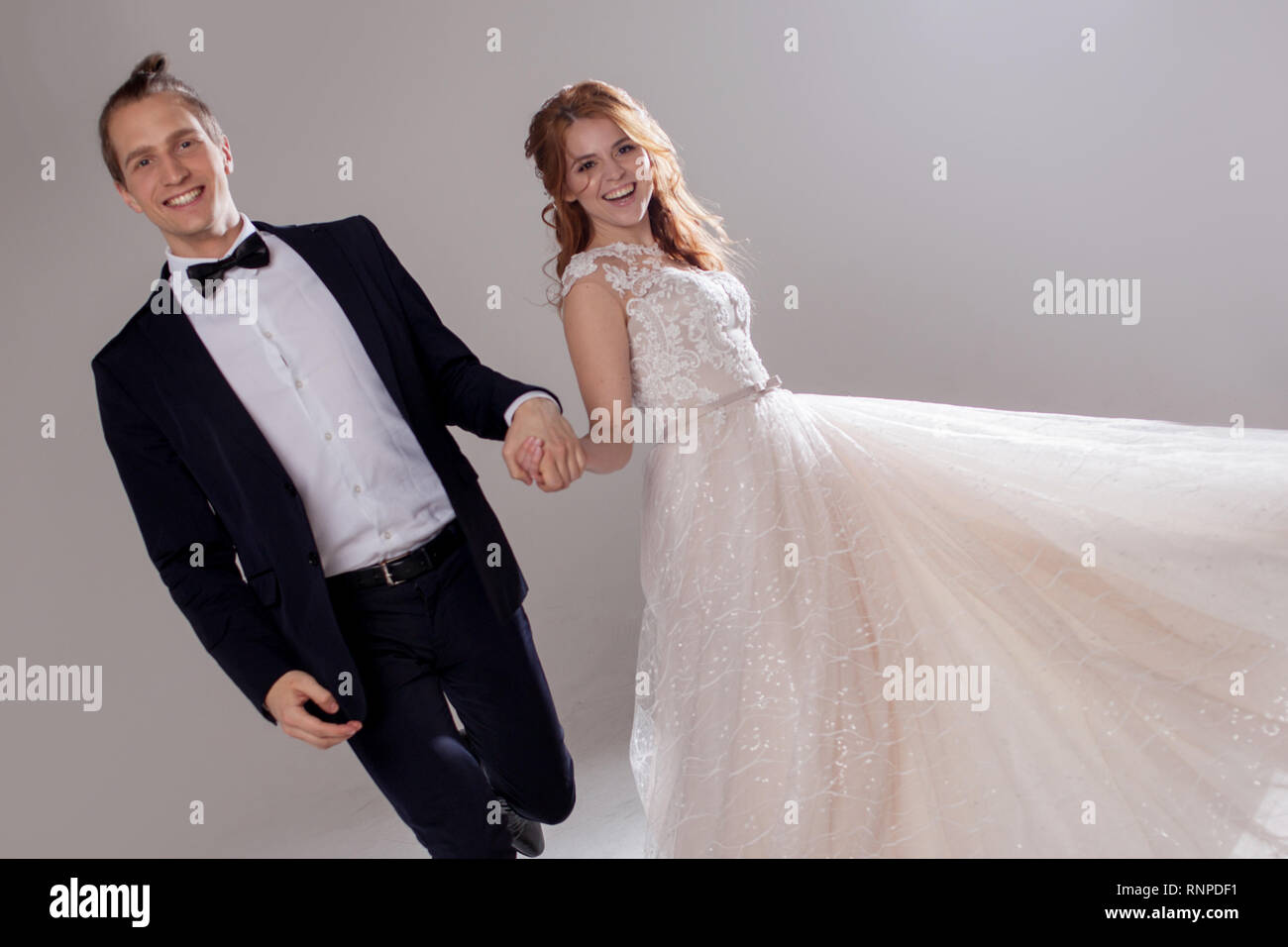 Happy young couple laughing and dancing together. The couple in the ...