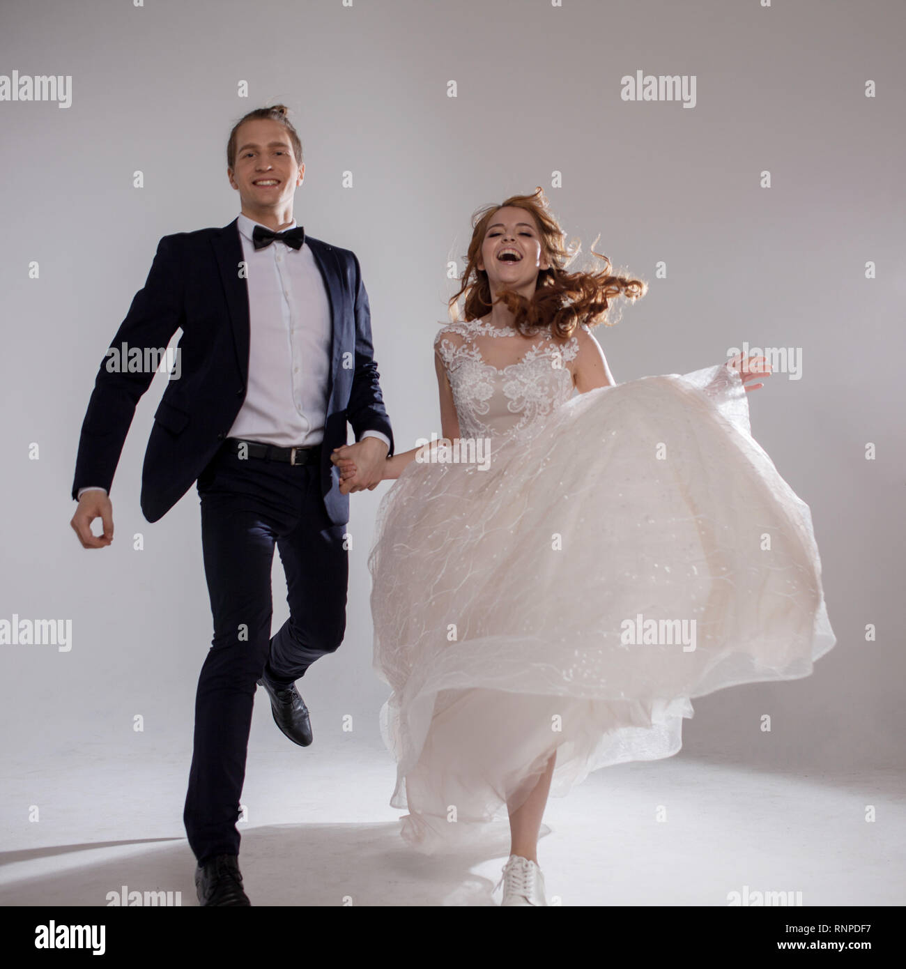 Happy young couple laughing and dancing together. The couple in the ...