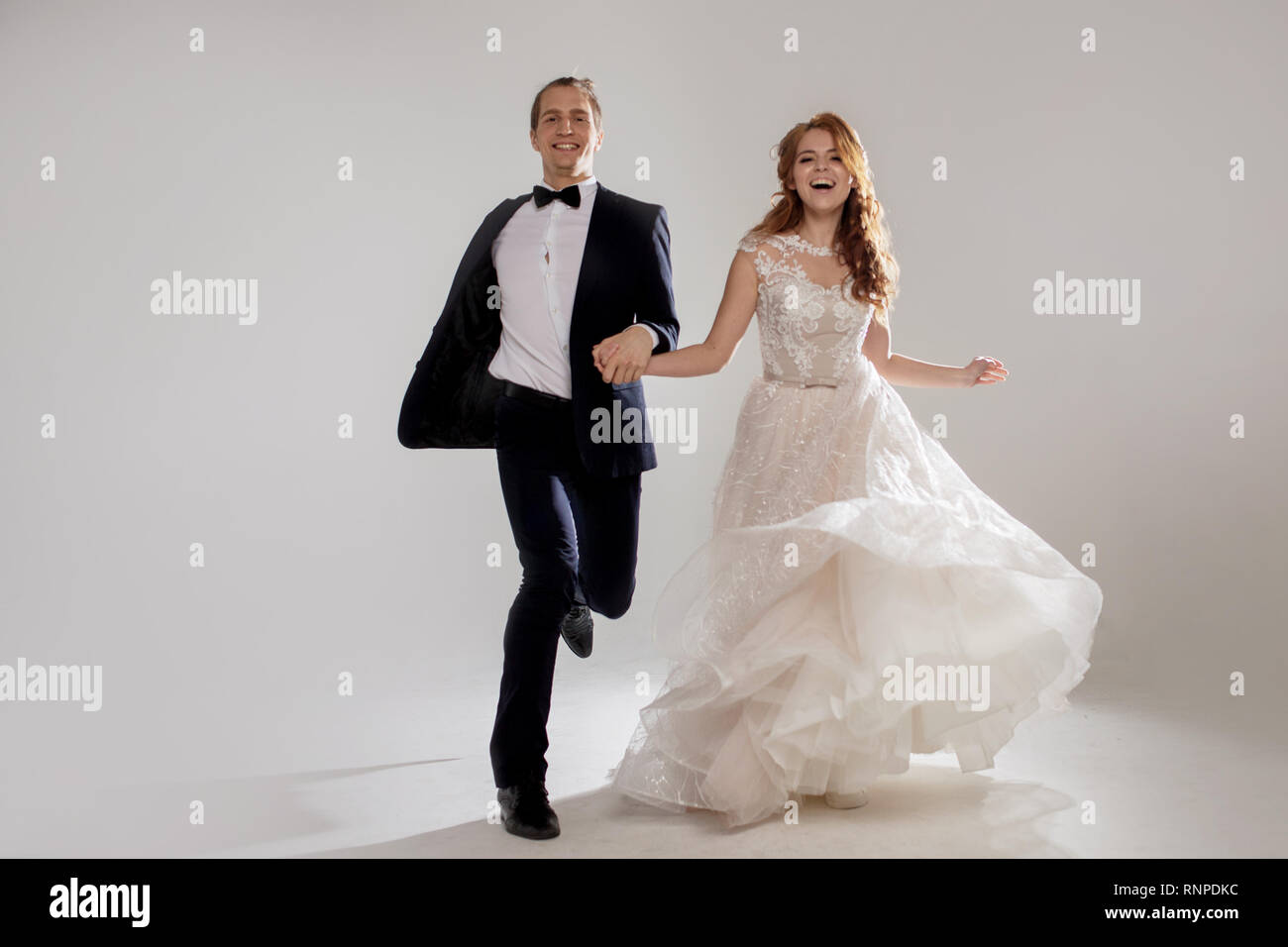 Happy young couple laughing and dancing together. The couple in the ...
