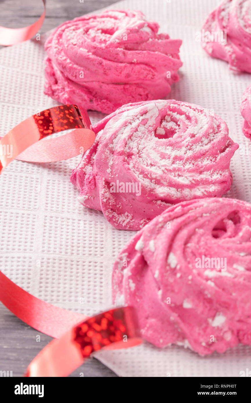 Homemade pink marshmallow on a white kitchen napkin close-up. From ...