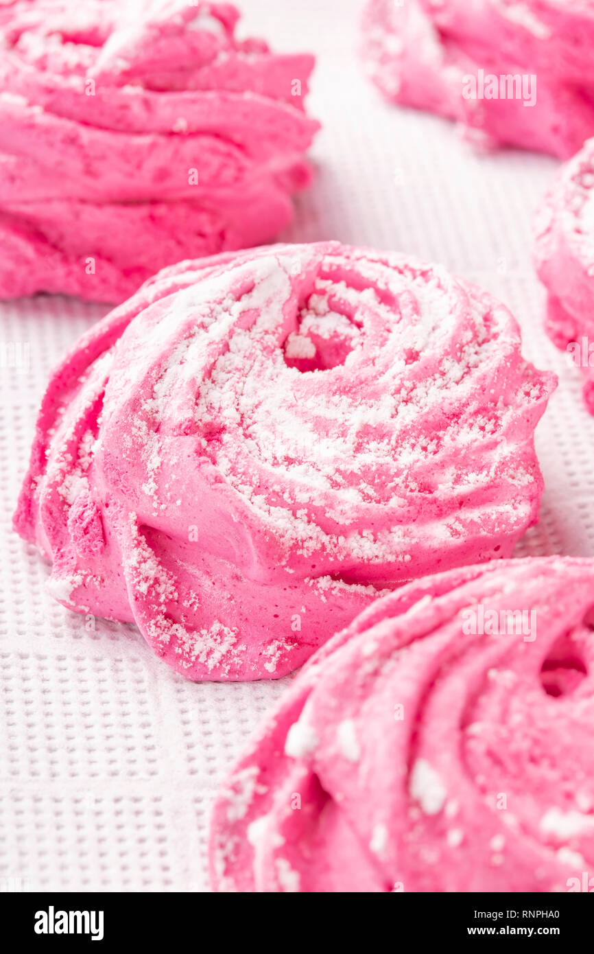 Homemade pink marshmallow on a white kitchen napkin close-up. From ...