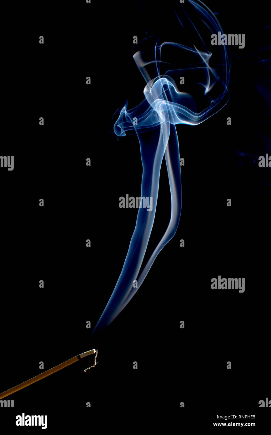 Swirls of bright blue fume Stock Photo - Alamy