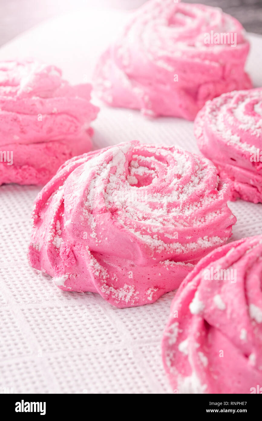 Homemade pink marshmallow on a white kitchen napkin close-up. From ...