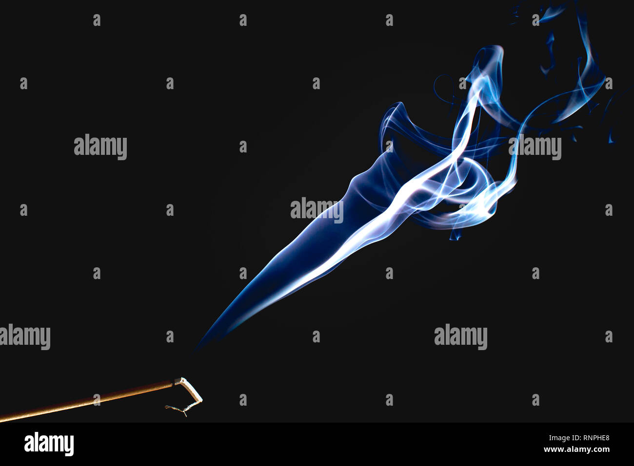 Swirls of bright blue fume Stock Photo - Alamy