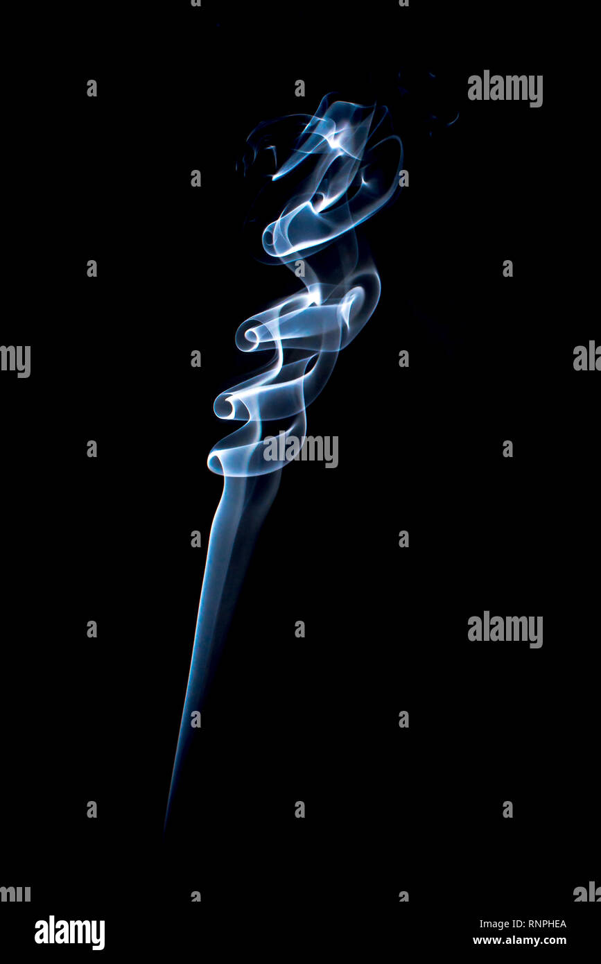 Swirls of bright blue fume Stock Photo - Alamy