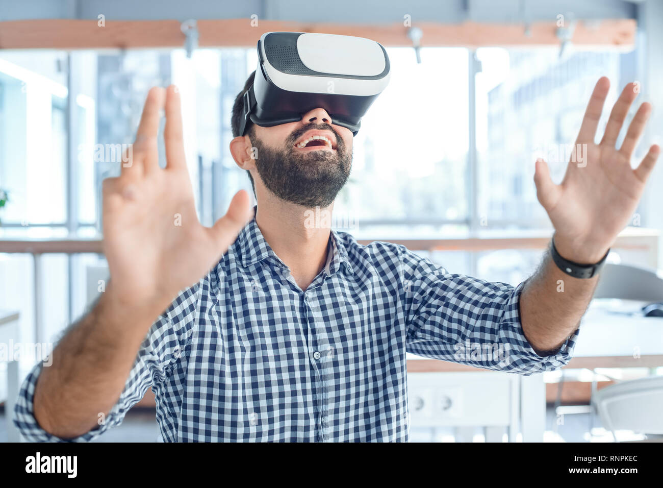 Business person using virtual reality headset joy Stock Photo - Alamy